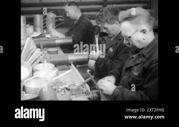 GERMANY - 1947 - Prisoners in a US Army camp work in a metal shop and ...