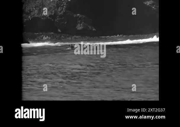1945 - Surrendered Japanese soldiers swim to offshore LCI, climb onto ...
