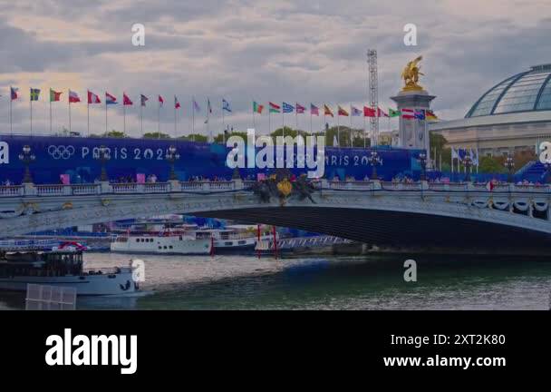Decorating the Alexander Bridge in Paris with Olympic symbols and the ...