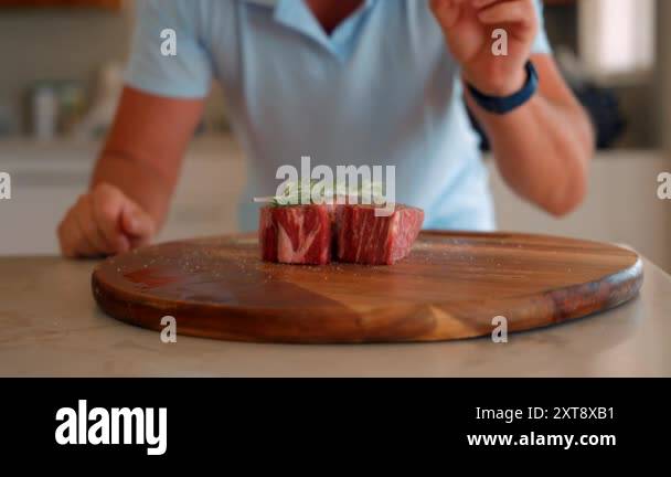 Slicing juicy beef steak by knife in chef hands closeup. Food cooking ...
