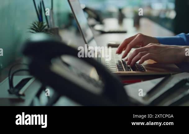 Employee hands typing keyboard laptop in office closeup. Unrecognizable ...