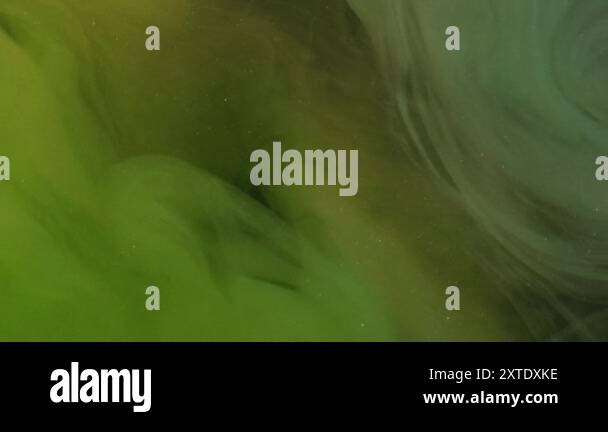 Shimmering cloud. Ink water flow. Blur green color glitter dust ...