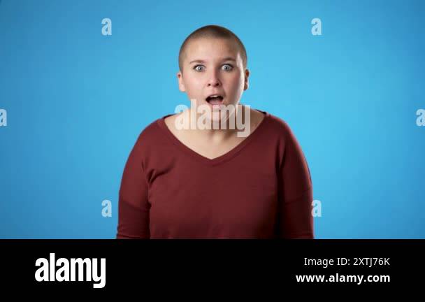 Pretty thinking non binary gender fluid young woman 20s, looks at ...