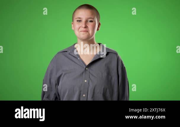 Portrait of happy gender fluid non binary young woman 20s smiling and ...