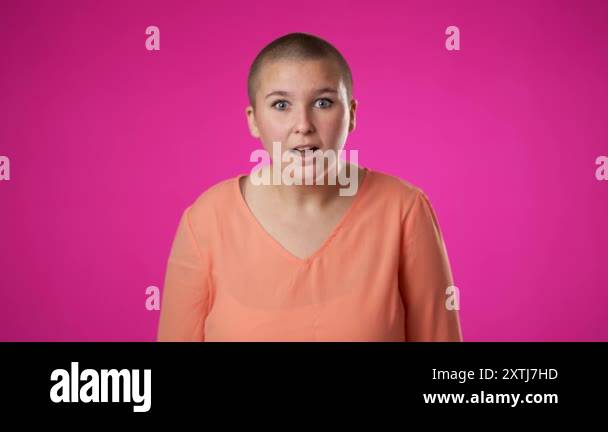 Portrait of surprised excited young gender fluid non binary woman 20s ...