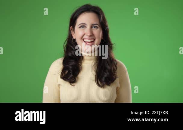 Pretty brunette long hair young woman nod head yes, agreeing, posing ...