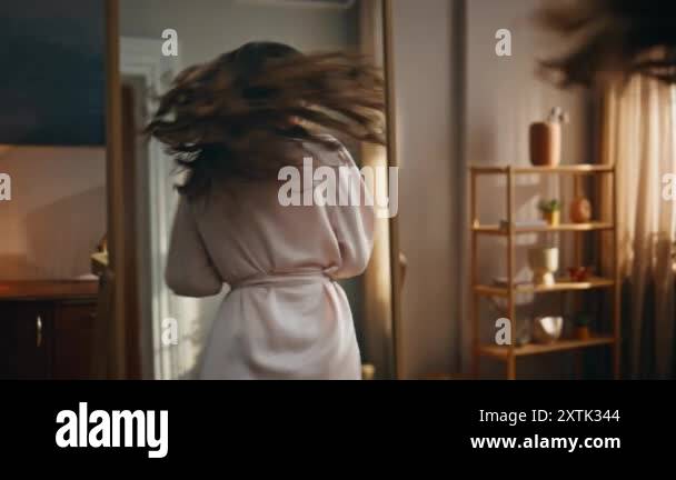 Joyful woman mirror reflection at living room zoom out. Excited happy ...