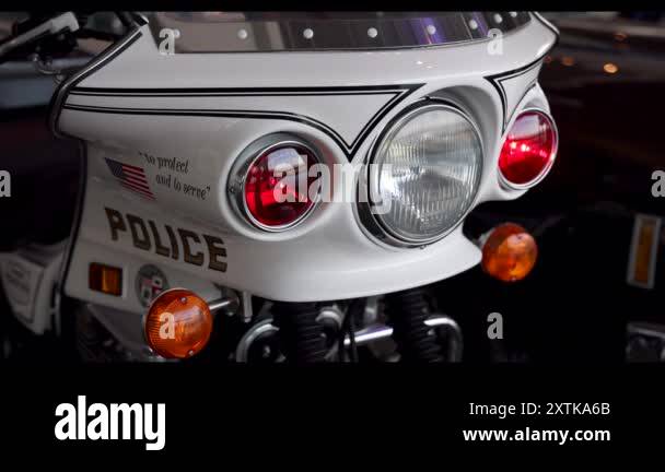 This closeup shows a classic police motorcycle, highlighting its ...