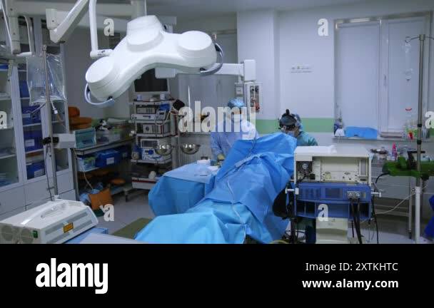 Surgical procedure conducted in the modern operational room. Doctor ...