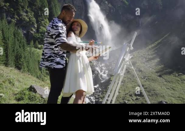 Loving young couple together on nature background. Artist couple in ...