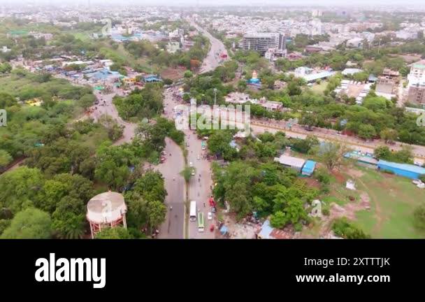 Aerial view of suburban area with roads, Small buildings and greenery ...