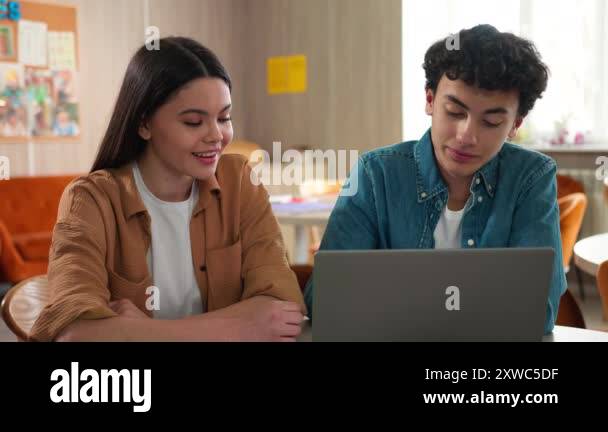 Two friends classmates partners project education school university ...