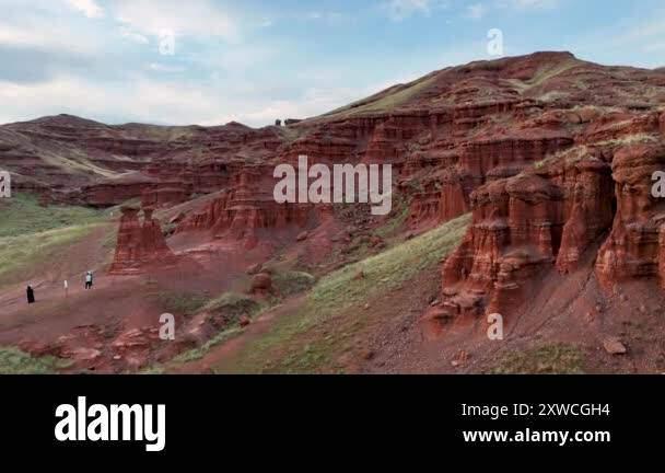 Red fairy chimneys shaped like formations that are millions of years ...