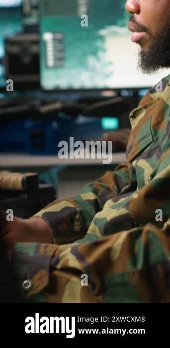 Vertical video Officer doing tasks in military base, planning, analyzing and gathering ...