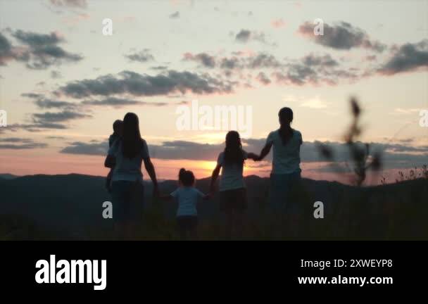 Children's teamwork, group of children playing in park. Mother with ...