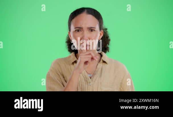 Girl, shh and finger on mouth for quiet, silence and whisper on green ...