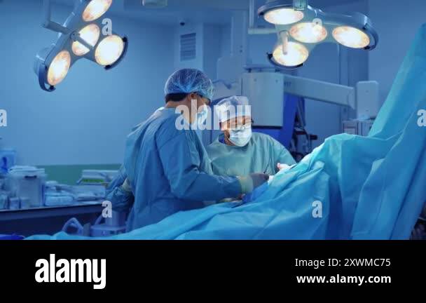 Surgical team stand around the surgical table. Doctors collaborating at orthopedic operation ...
