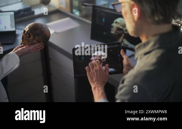 Two archaeologists study fossil skull, create 3D model of prehistoric ...