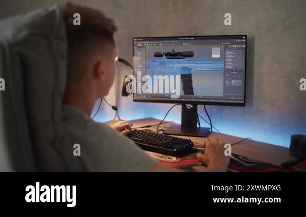 Caucasian teenager creates 3D model and animation of sniper rifle using ...