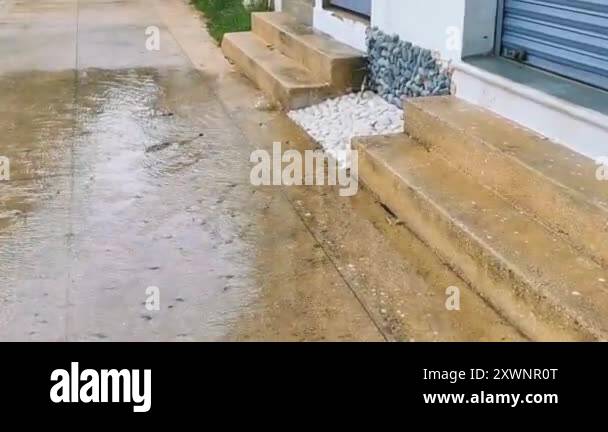 Water flows from the gully during extreme rain and storms extreme wind ...