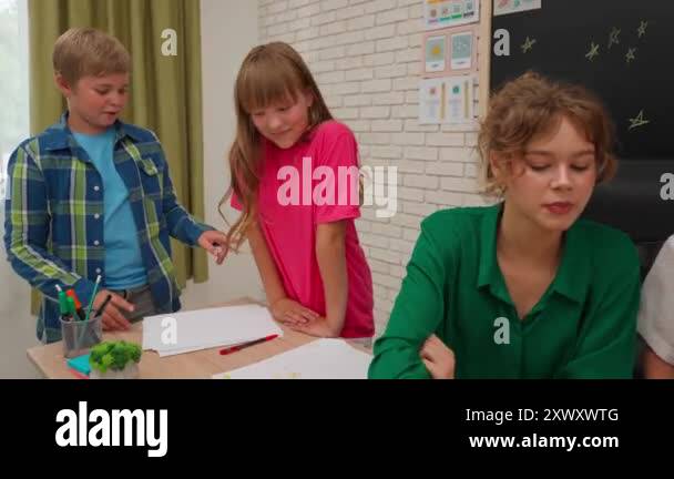 Group of primary school kids learning science in class. Junior school ...