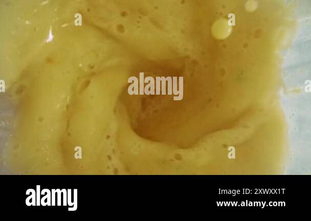 Top view of a glass blender flask with a vegetable smoothie. The mixed ...