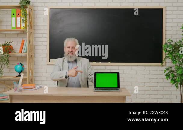 School teacher in auditorium during lesson. Aged man college professor ...