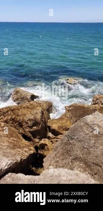 The beach of Portugal near caparica, where clear and clean water with ...