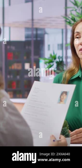 Vertical Video During a structured job interview, applicant presents ...