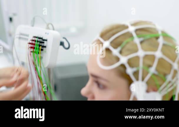 Female patient undergoing an EEG test, showcasing modern healthcare and ...