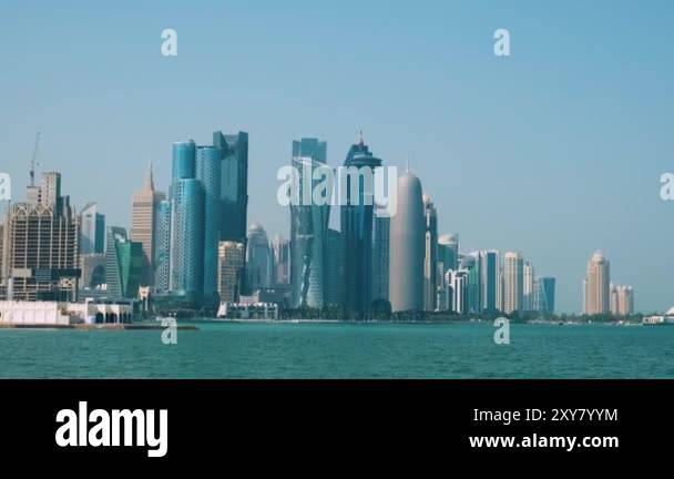 Skyline of Doha city business center with futuristic skyscrapers and a ...