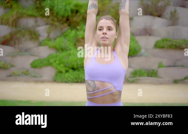 Strong and beautiful woman embraces the outdoors as she practices ...