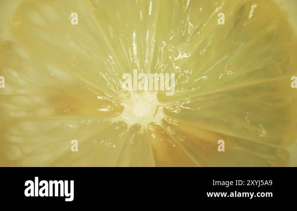 Close-up of the inside of a lime. The flesh lime is a pale yellow-green ...