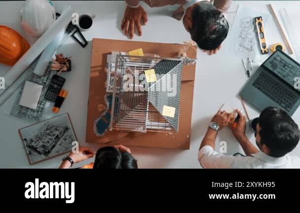 Top down aerial view of architect writing sticky note and placed at ...