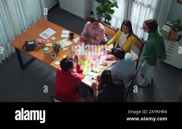 Close up of professional business team hands writing and putting sticky ...