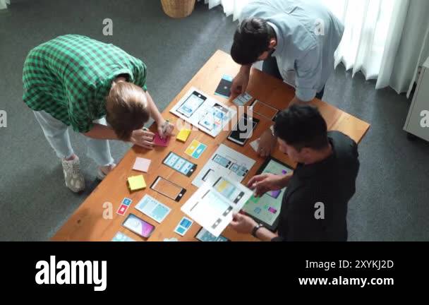 Top view of smart Ui designer brainstorming and planning about Ux Uo design or mobile interface ...