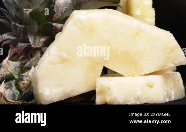 Close up video of fresh pineapple with slice of peel pineapple insert ...