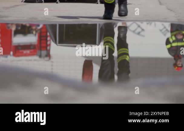 reflective scene captures a firefighter heading into a dangerous ...