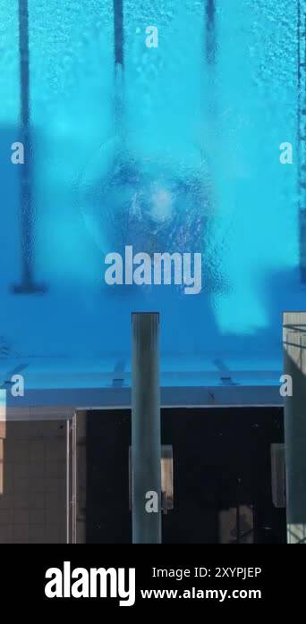 Drone footage in reverse capturing the surreal moment of a diver ...