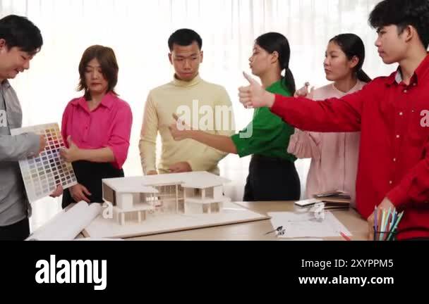 Slow motion home designer using architectural equipment draw a ...