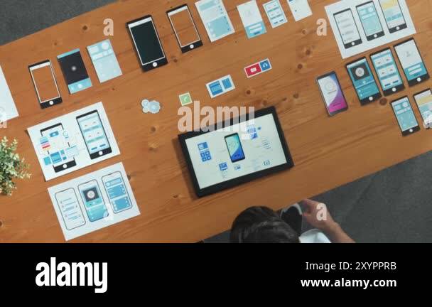 Top view of skilled caucasian software developer looking at develop ...