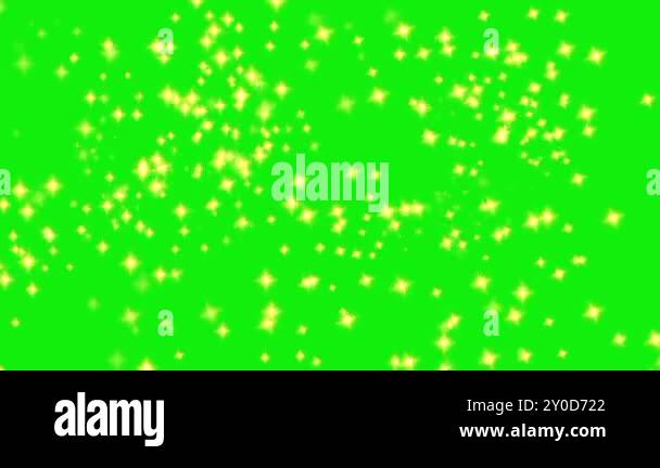 raining gold light sphere on the green screen background. bright ...