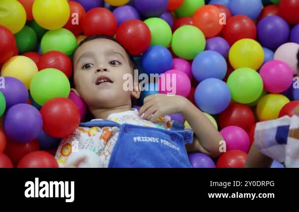 cute Indian baby boy enjoying at kid indoor play from top angle Stock ...