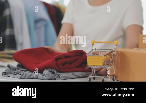 Hand holding clothes Stock Videos & Footage - HD and 4K Video Clips - Alamy