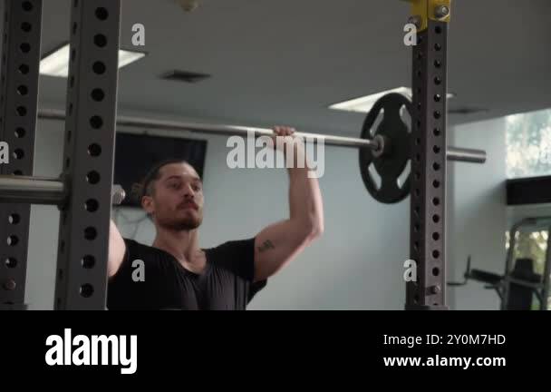 Young caucasian man work out in fitness gym with motivation and ...