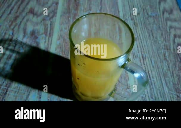 4k Closeup fizzy tablets in water, the process of dissolving vitamin C ...