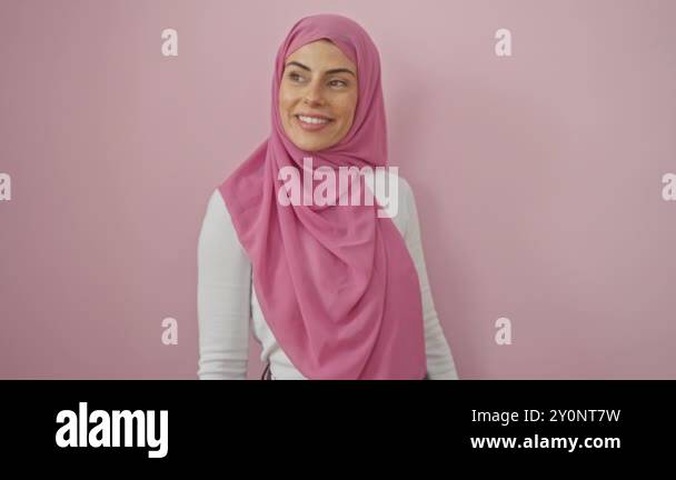 Confident young hispanic woman in hijab smiles naturally, trust ...