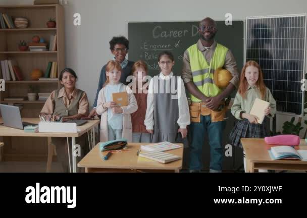Full portrait of African American male solar panel engineer ...