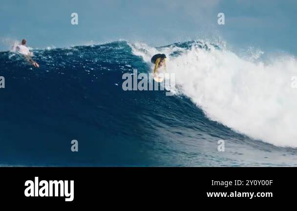 Experienced surfer rides huge, double overhead ocean wave at the famous ...