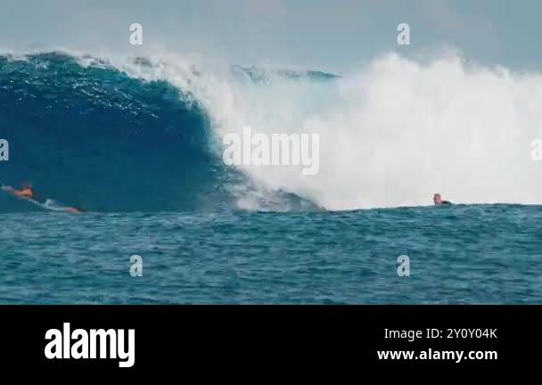 Experienced surfer rides huge, double overhead ocean wave at the famous ...